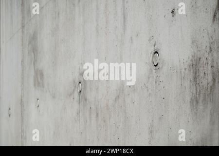 Concrete wall with round wholes Stock Photo - Alamy