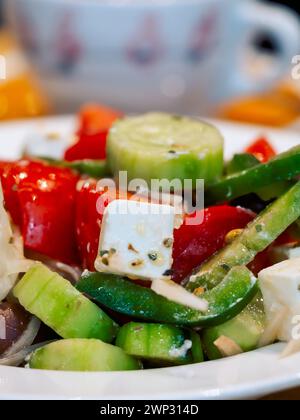 Greek salad with feta cheese and pieces of dried rye bread Stock Photo ...