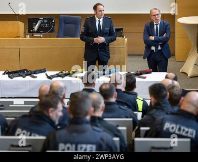 Meiningen, Germany. 05th Mar, 2024. A police officer holds the "FN ...