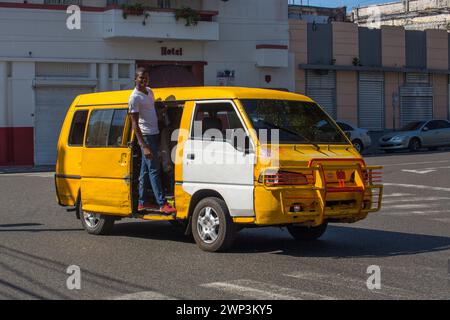 Beat-up minivans called guaguas serve as cheap public transportation in ...