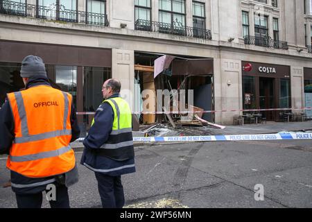 View of damages at the entrance to All One Bar on New Oxford Street ...