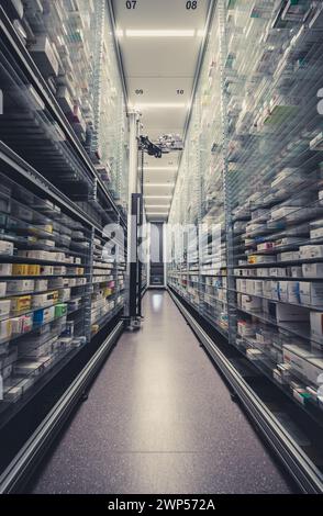Photography of a pharmacy storage room and a robot hand are arranging ...