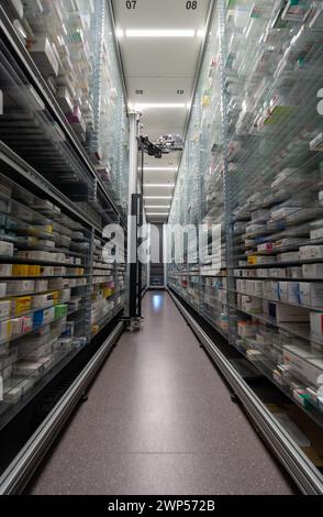 Photography of a pharmacy storage room and a robot hand are arranging ...