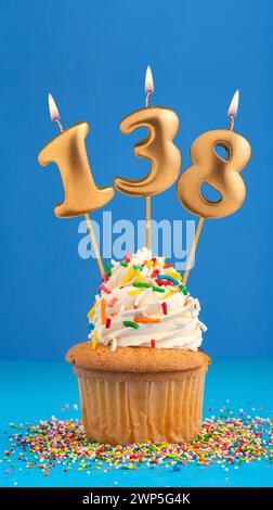 Birthday cupcake with candle number 138 - Coral fusion background Stock ...