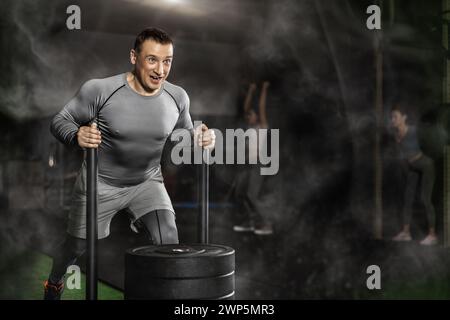 Man during grueling workout with element of push and pull superset in ...