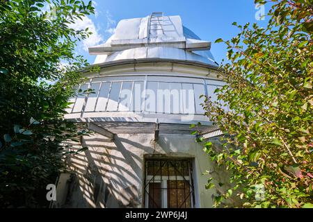 Exterior view of the curved doors of a small, white observatory ...