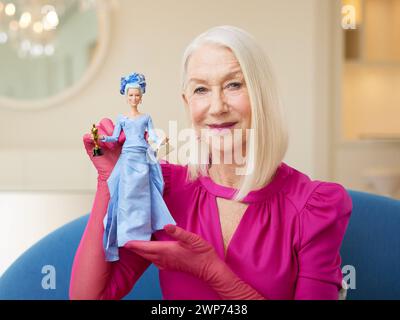 Non Exclusive: Dame Helen Mirren holding her one-of-a-kind Barbie doll ...
