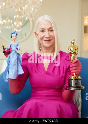 Non Exclusive: Dame Helen Mirren holding her one-of-a-kind Barbie doll ...