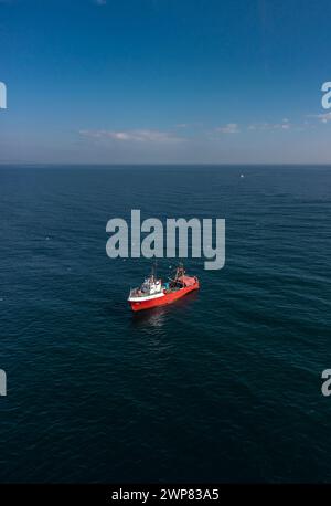 Aerial view to a red fishing vessel in sea Stock Photo - Alamy