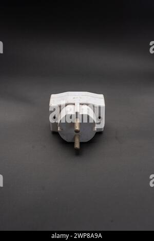 Dirty used triple outlet tap. Electric energy adapter used to split ...