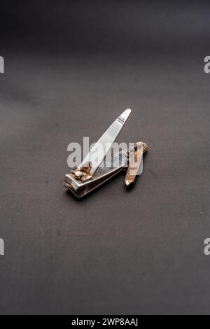 Dirty and rusty used nail clippers made of stainless steel isolater on ...