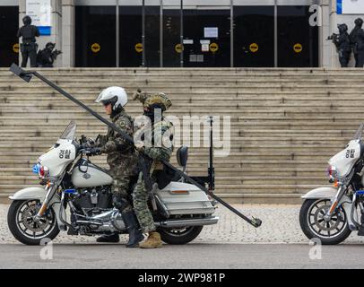 An armed motorcycle police officer of the Special Escort Group SEG ...