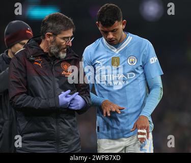 Matheus Nunes of Manchester City comes away from his injury with his ...