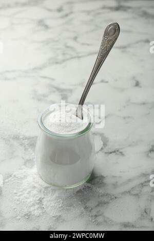 Jar and spoon with baking soda on white wooden background Stock Photo ...