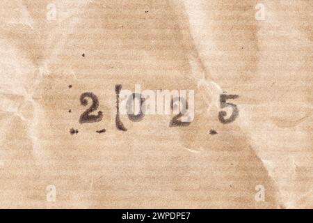 2025 ink rubber stamp on crumpled brown paper Stock Photo - Alamy