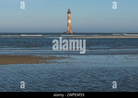 Morris Island Lighthouse from the shoreline of Folly Beach near ...