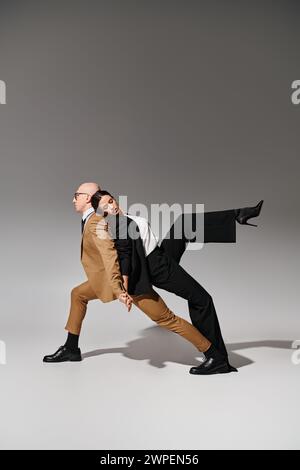 Contemporary dance. Man and woman in passionate dance pose in park ...