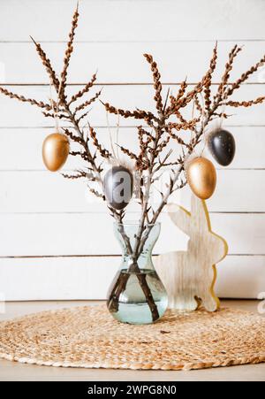 Colored Easter eggs hanging on dry branches. Easter concept Stock Photo ...