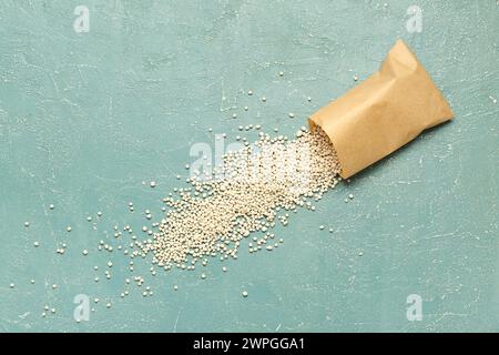 Paper bag with blue granular fertilizer isolated on white background ...