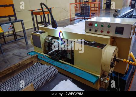 Lathe machine tapping steel rods Stock Photo - Alamy