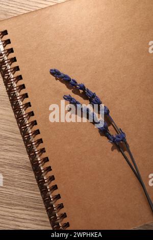 Lavender with notebook on wooden background Stock Photo - Alamy