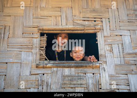 A Mro woman poses for a portrait with her child. Mro people are an ...