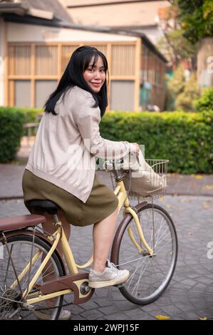 Young asian woman going shopping using smartphone at retail shop Stock ...