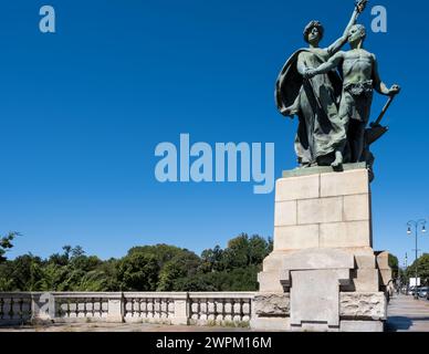 Architectural detail of statues adorning the Umberto I Bridge, spanning ...