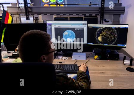 Uedem, Germany. 08th Mar, 2024. A Bundeswehr soldier sits in front of ...