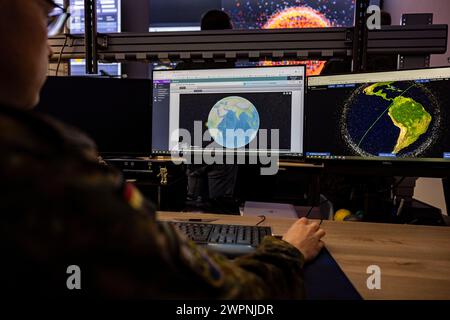 Uedem, Germany. 08th Mar, 2024. A Bundeswehr soldier sits in front of ...