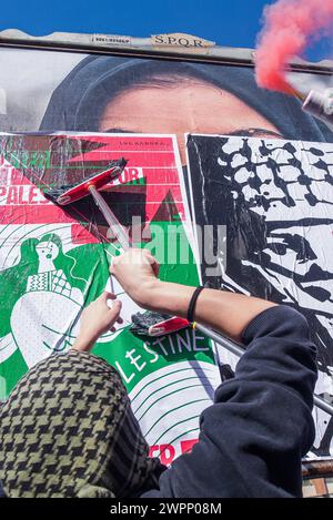 Women display posters during a rally against a fuel price hike ...
