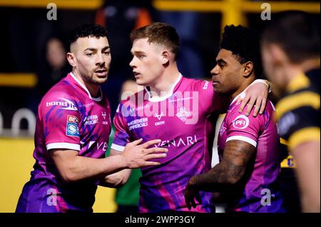 Huddersfield Giants' Sam Halsall (centre, facing) celebrates scoring ...