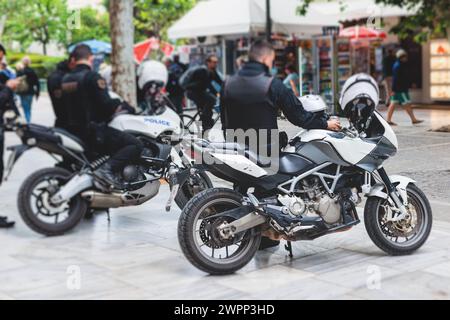 Hellenic Police, Greek police squad on duty riding bike and motorcycle ...