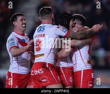 St Helens' Mark Percival and Jonny Lomax tackle Wigan Warriors' Liam ...