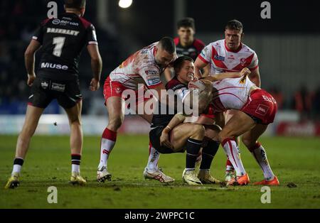 St Helens Deon Cross is tackled during the Grand Final Semi Final match ...