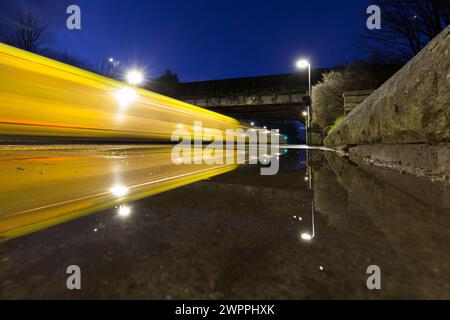 Merseyrail train arriving at Wallasey Grove Road station at night ...