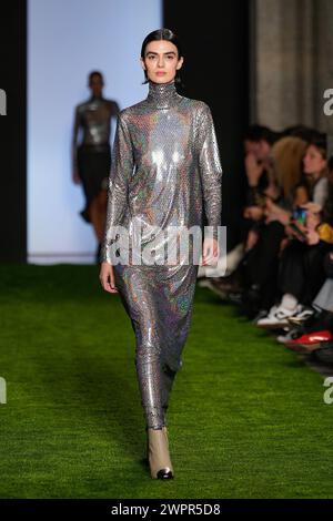 Lisbon, Portugal. 08th Mar, 2024. A model walks the runway during Luis ...
