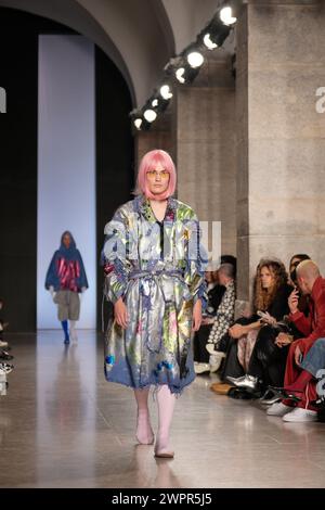 Lisbon, Portugal. 08th Mar, 2024. A model walks the runway during ...