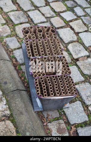 New Year's Eve waste or rubbish. Close-up of a used firework battery ...