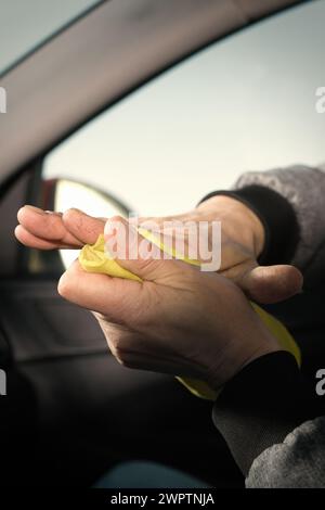 Older man take care annd cleaning car interior on nature parking Stock ...
