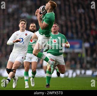 Tommy Freeman of England under pressure from Robbie Henshaw of Ireland ...