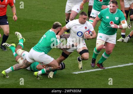 England's Ben Earl is tackled during the Guinness Men's Six Nations ...