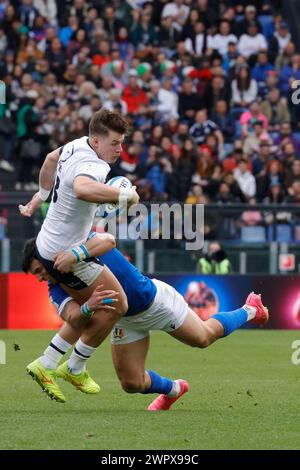 Huw Jones of Scotland is tackled by Juan Ignacio Brex of Italy during ...