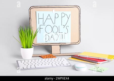 Carton computer screen, keyboard and notebooks on white background ...