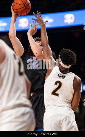 Florida forward Alex Condon (21) rebounds pressured by Vanderbilt guard ...