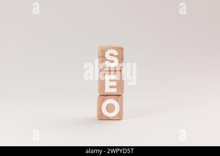 Wooden blocks with symbol of seo concept on blue background Stock Photo ...
