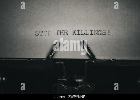 STOP THE KILLINGS typed words on a vintage typewriter. Close up ...
