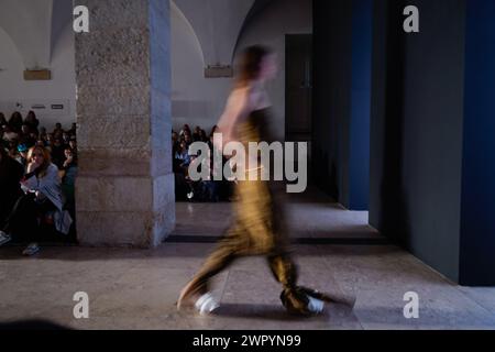 Lisbon, Portugal. 09th Mar, 2024. A model walks the runway during the ...