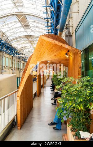 Free to use wooden seat cubicles outside a bookshop on the second level ...