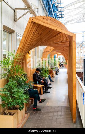 Free to use wooden seat cubicles outside a bookshop on the second level ...